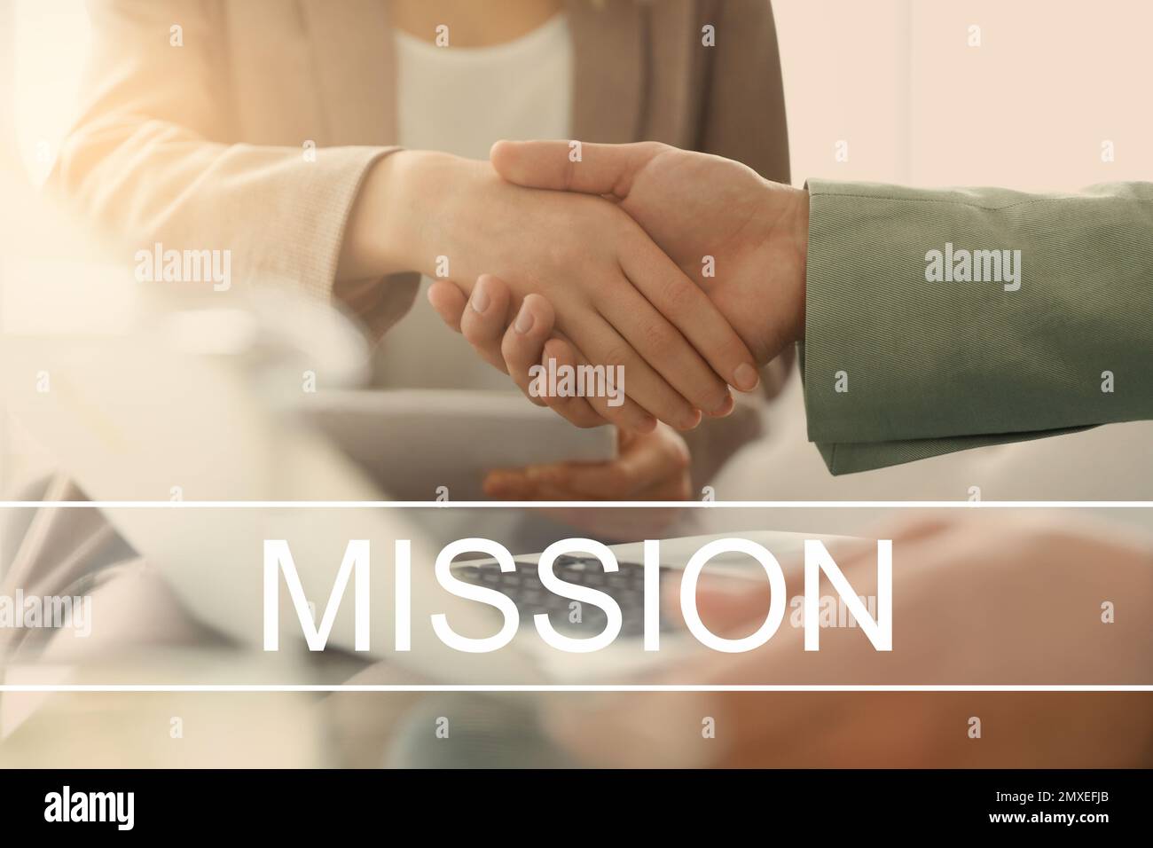 People shaking hands and text MISSION, closeup Stock Photo - Alamy