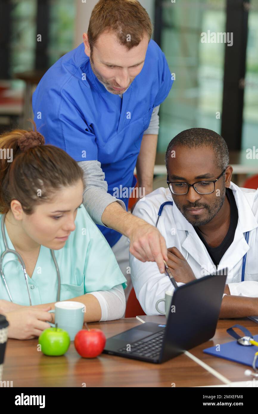 doctors talking together in rest room Stock Photo - Alamy