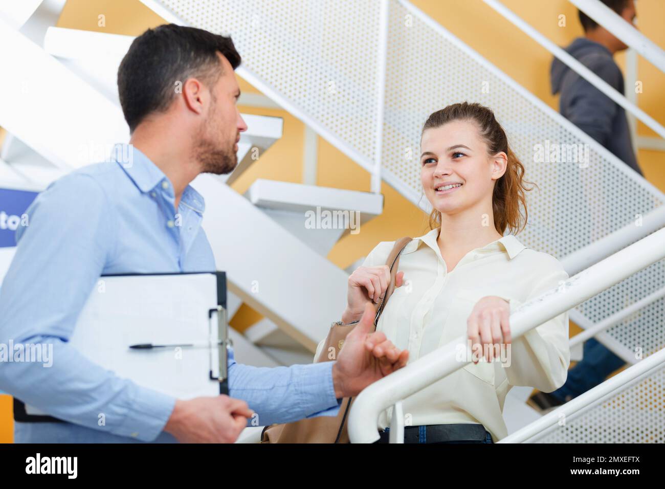 Workers talking corridor hi-res stock photography and images - Alamy