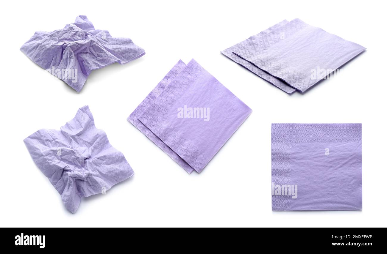 Set with violet paper napkins on white background Stock Photo - Alamy