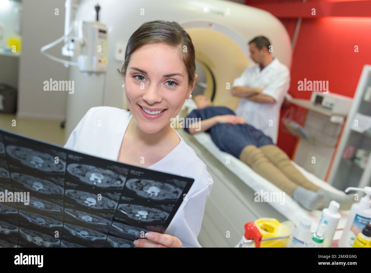 nurse holding xrays patient on mri scanner in background Stock Photo ...