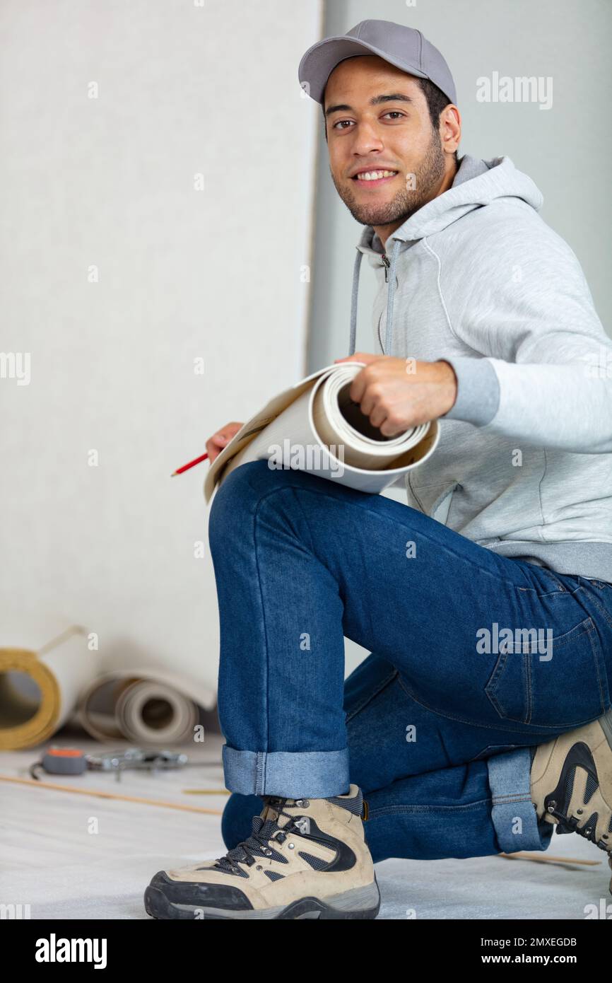 industrial tiler builder worker installing floor Stock Photo - Alamy