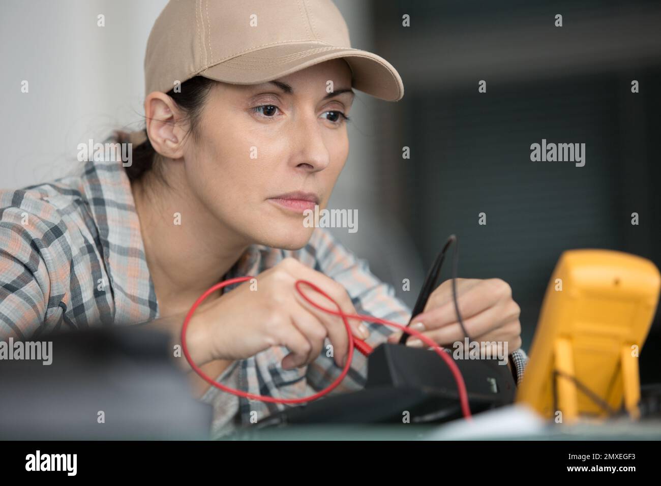 female technician using a multimeter Stock Photo - Alamy