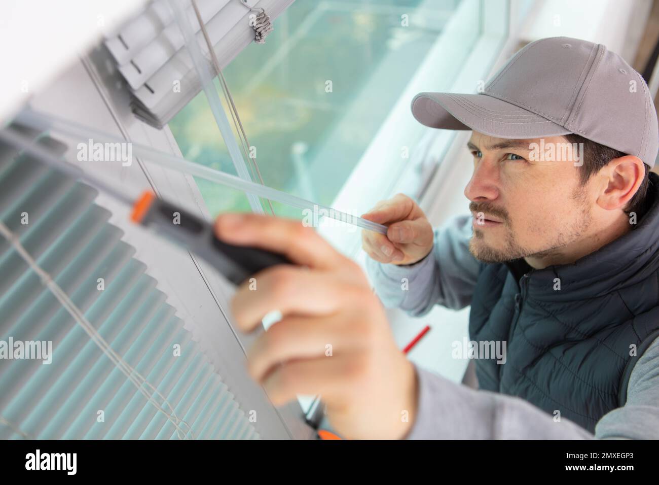 Installing window blinds hi-res stock photography and images - Alamy