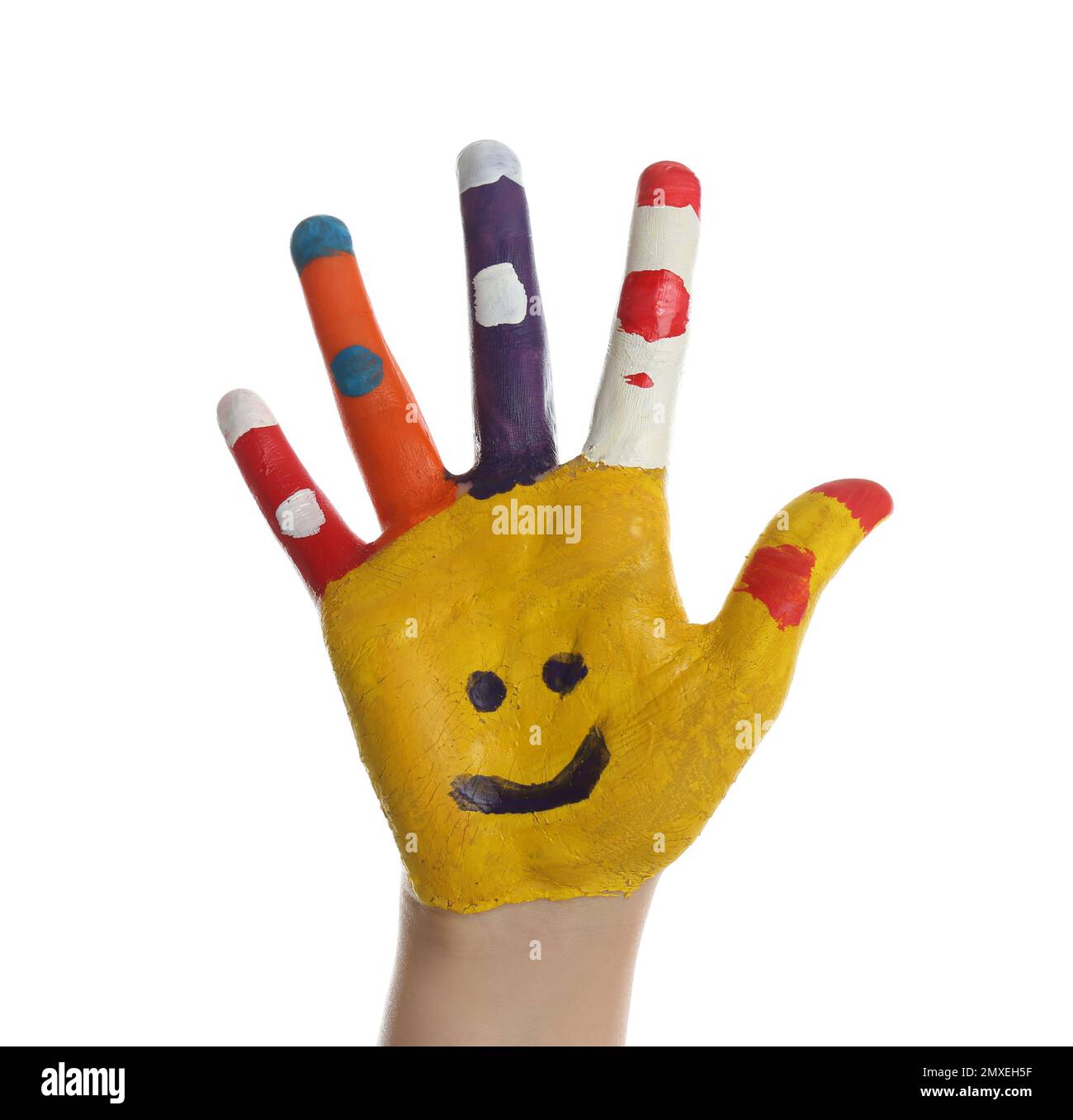 Kid with smiling face drawn on palm against white background, closeup ...