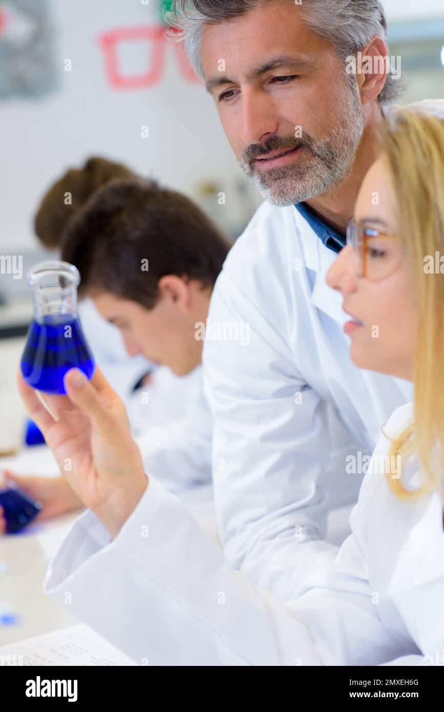 student and teacher - lab experiment Stock Photo - Alamy