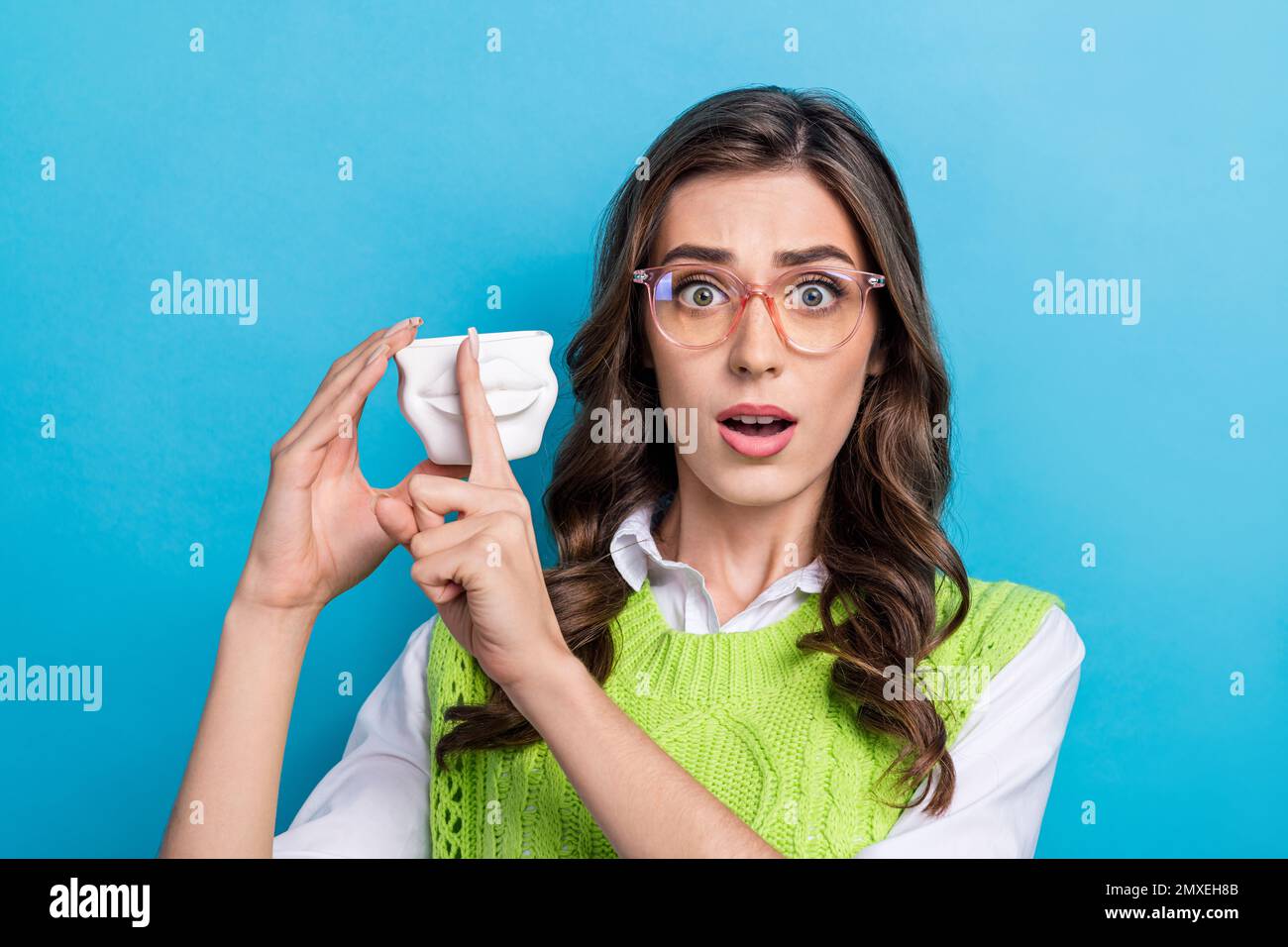 Photo of worried puzzled person arm hold fake artwork lips show shh ...