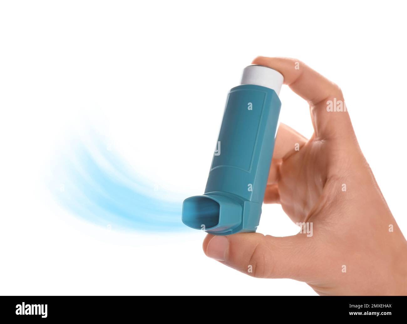 Man holding asthma inhaler with steam on white background, closeup ...