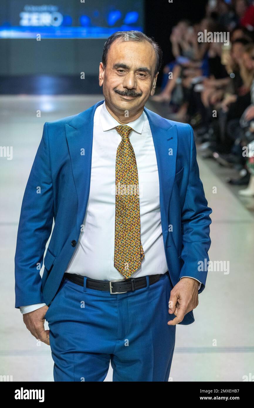 Dr. Ash Tewari walks the runway wearing Huntsman during the Seventh ...