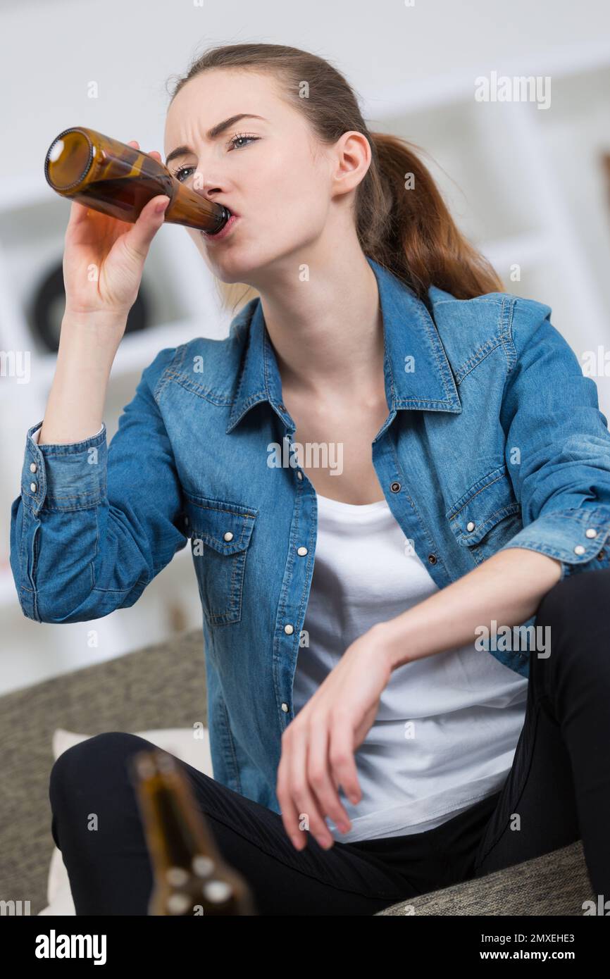 Crying woman drinking alcohol alone hi-res stock photography and images ...