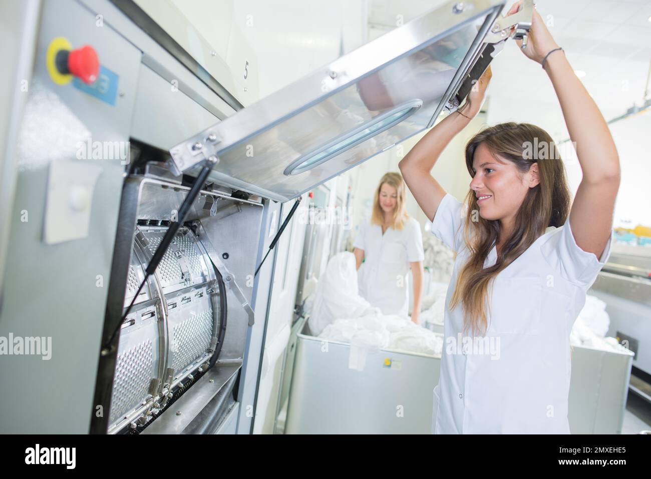 workers using industrial washing machines Stock Photo - Alamy