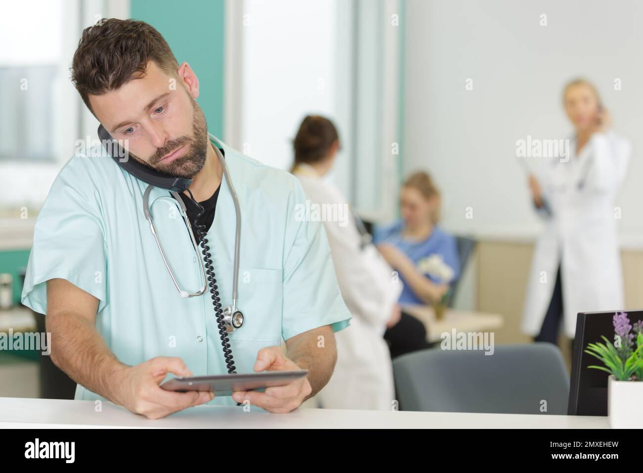 doctor on the phone holding the tablet with stethoscope equipment Stock ...