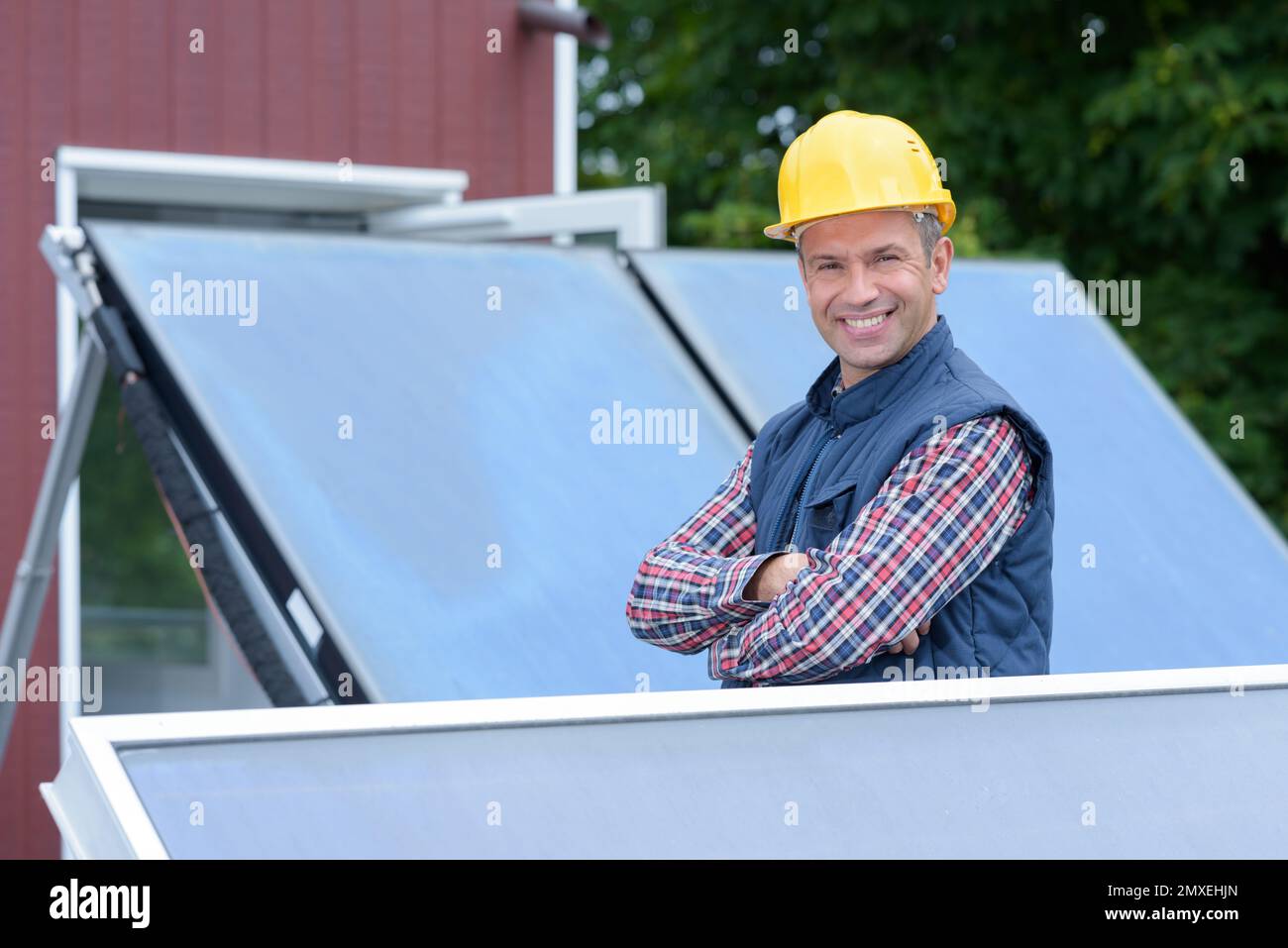 Worker solar power station smiling hi-res stock photography and images ...