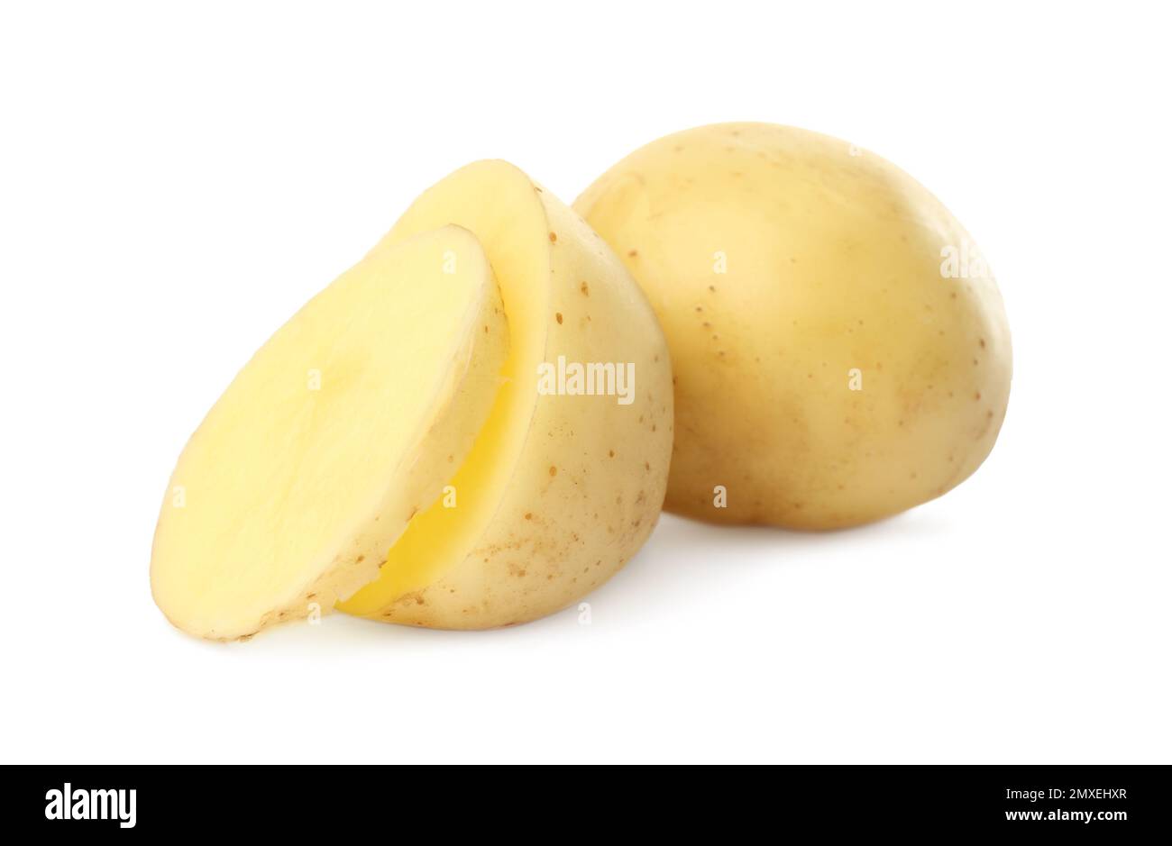 Whole and cut fresh raw organic potatoes on white background Stock ...