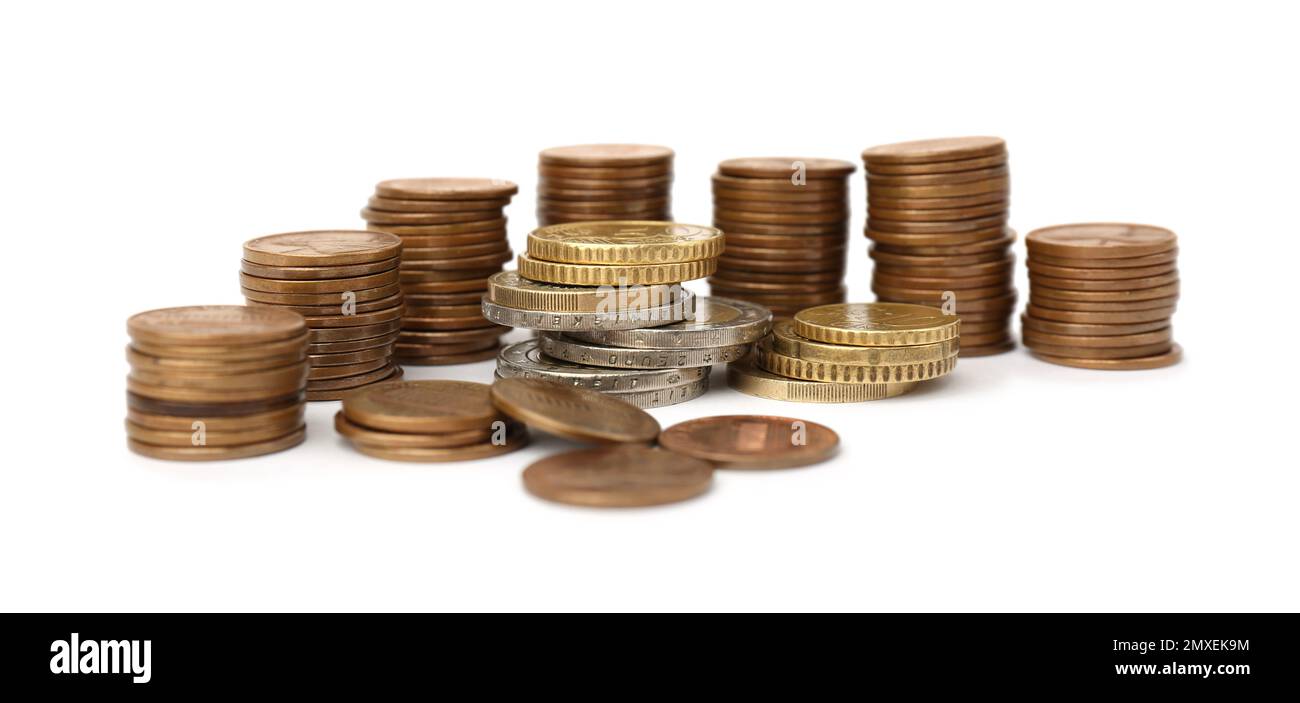 Stacks of metal coins on white background Stock Photo - Alamy