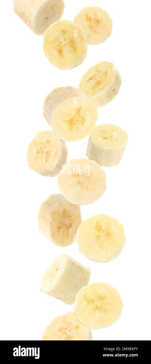Set with delicious ripe banana pieces falling on white background Stock ...