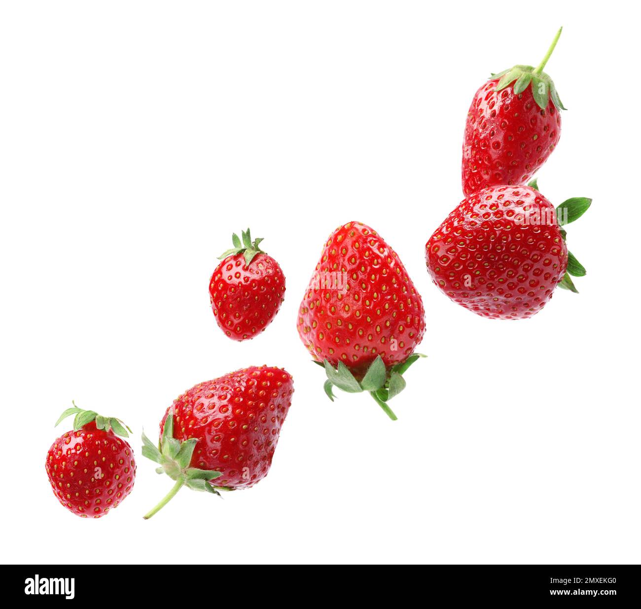 Set with ripe strawberries falling on white background Stock Photo - Alamy
