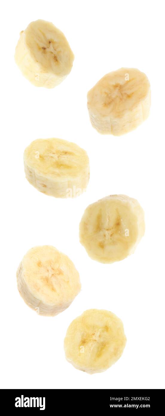 Set with delicious ripe banana pieces falling on white background Stock ...