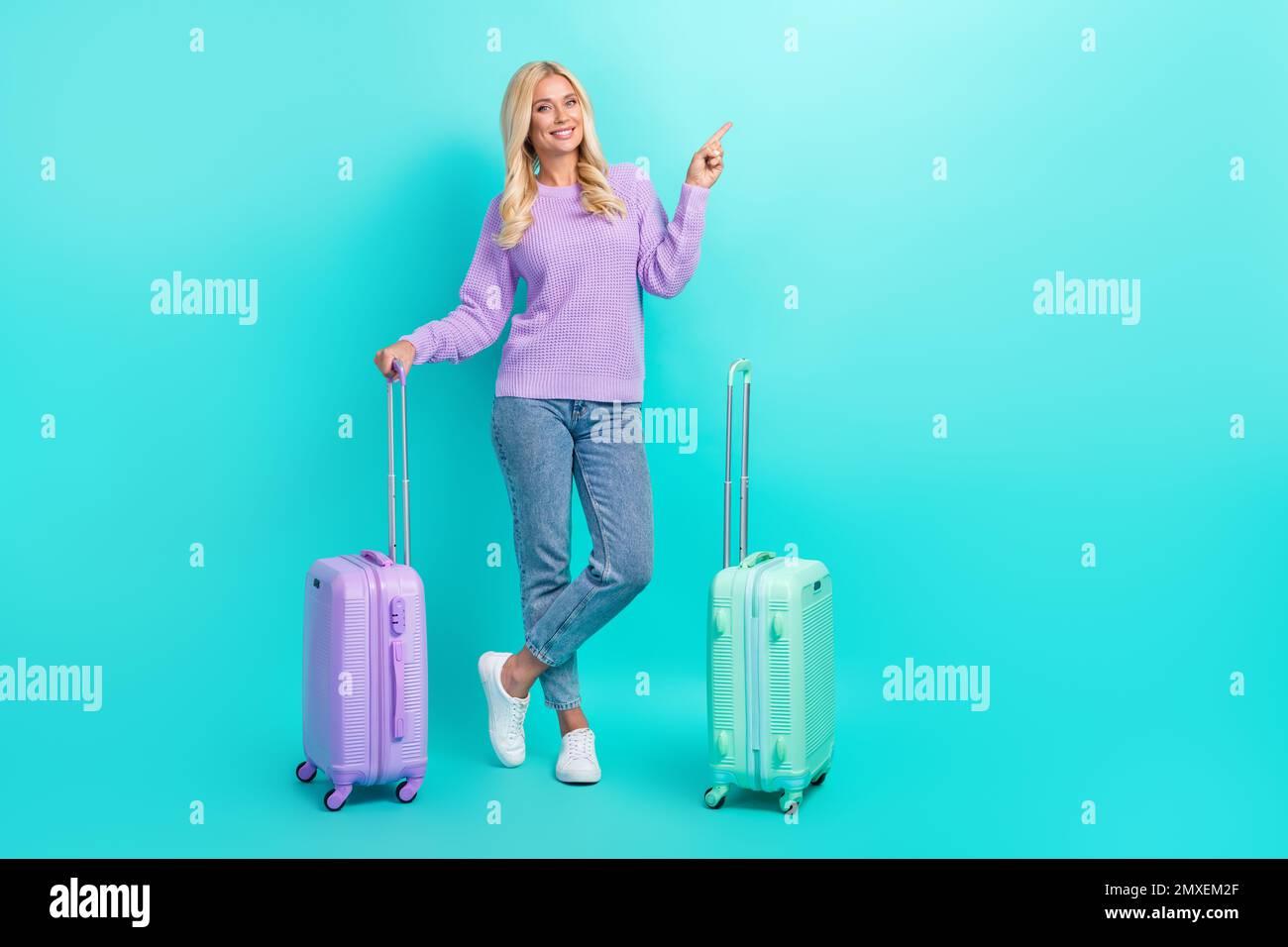 Full size photo of positive nice person indicate finger empty space two ...
