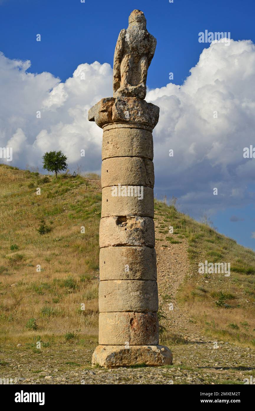 A vertical shot of the eagle-topped column in Karakus Tumulus, Turkey ...