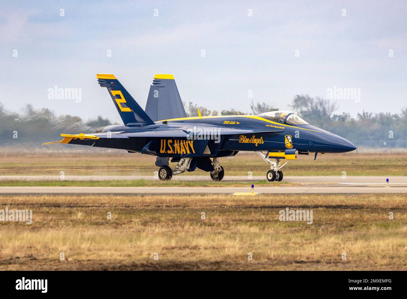 The Blue Angel two airplane parked with a cloudy sky in the background ...