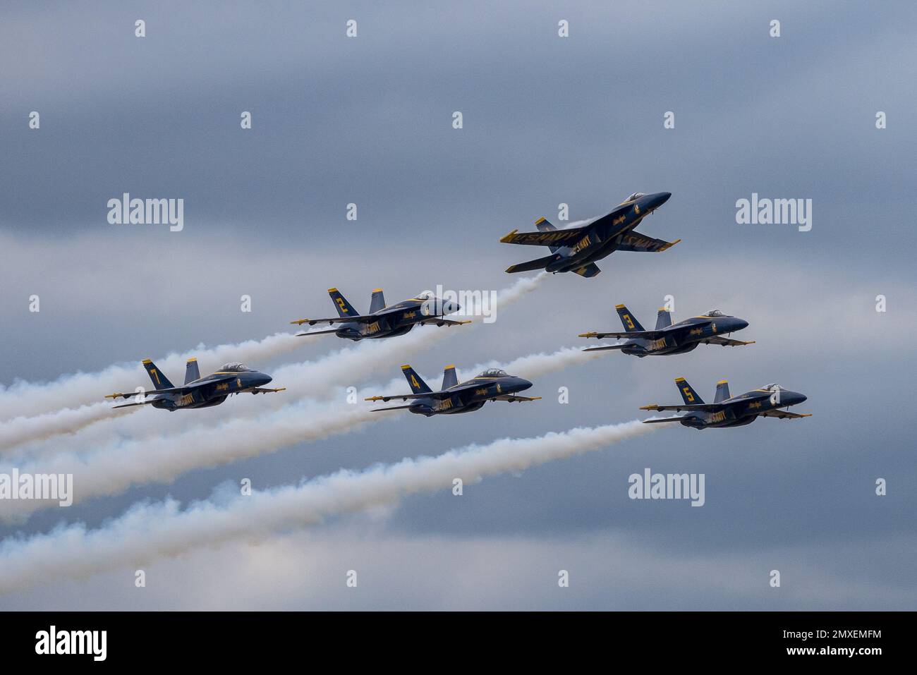 The Blue Angels formation planes flying over Houston against a cloudy ...
