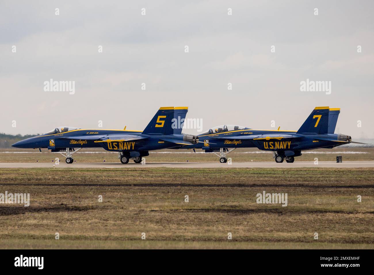 The Blue Angels airplanes parked with a cloudy sky in the background ...