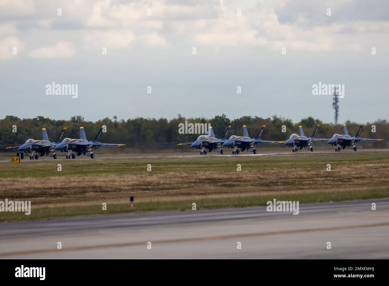 The Blue Angels airplanes parked with a cloudy sky in the background ...