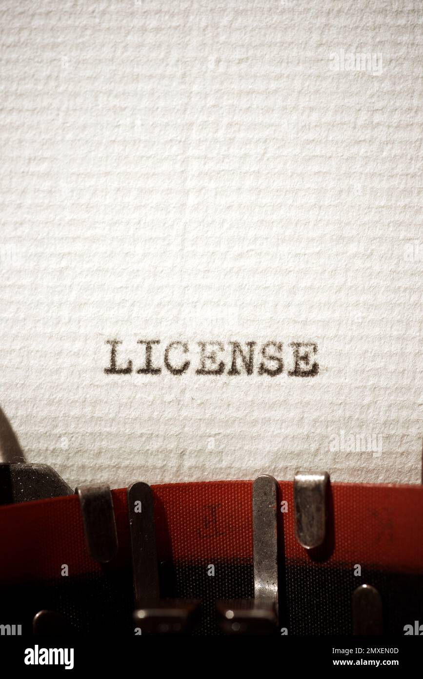 License word written with a typewriter Stock Photo - Alamy
