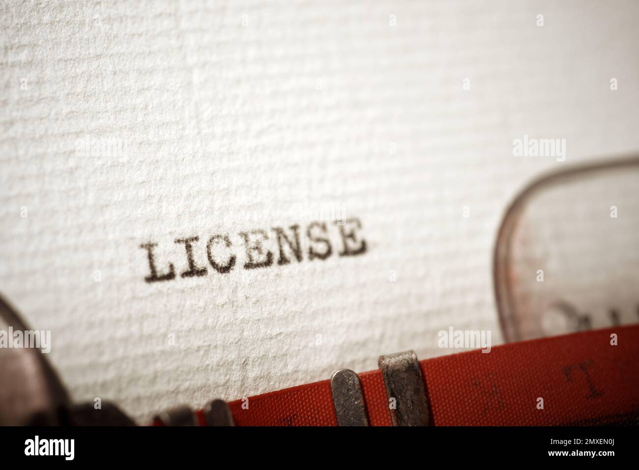 License word written with a typewriter Stock Photo - Alamy