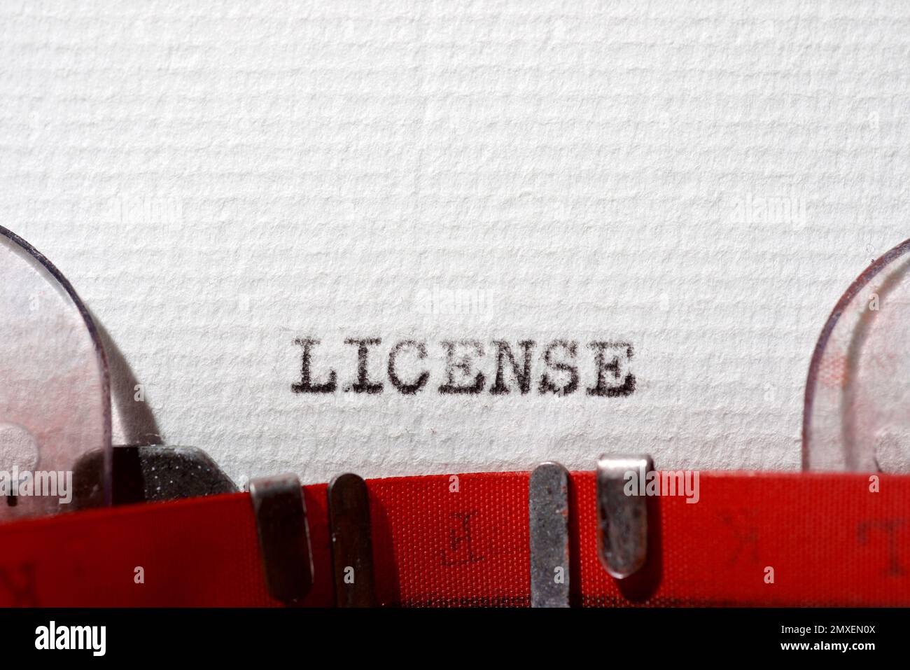 License word written with a typewriter Stock Photo - Alamy