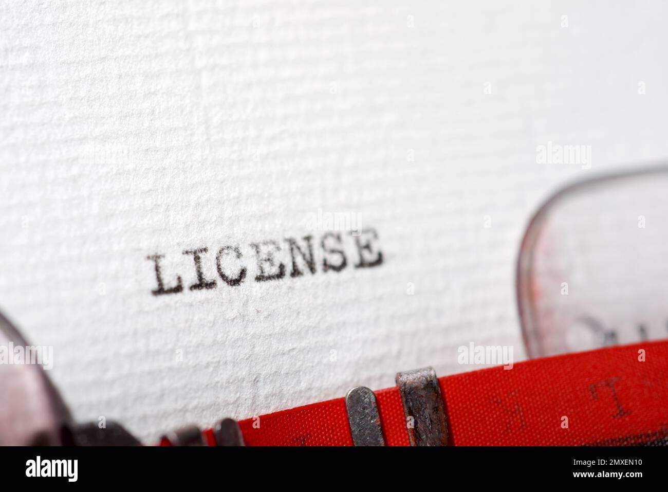 License word written with a typewriter Stock Photo - Alamy