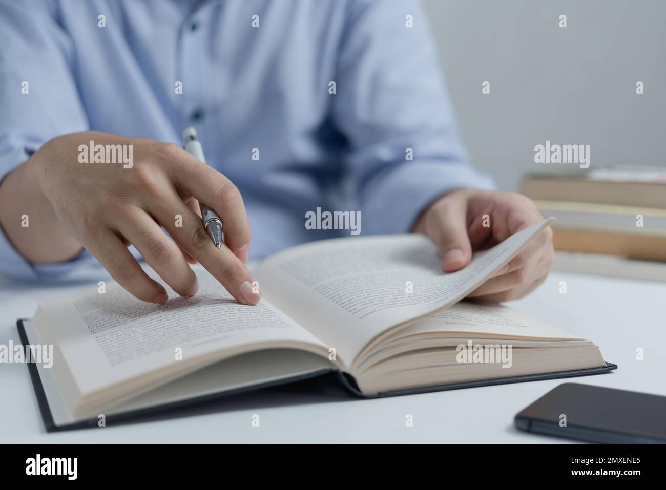 Businessperson reading and writing on book.education studying knowledge ...