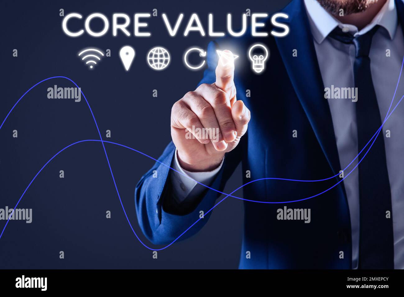 Core values concept. Businessman pointing at icon on virtual screen ...