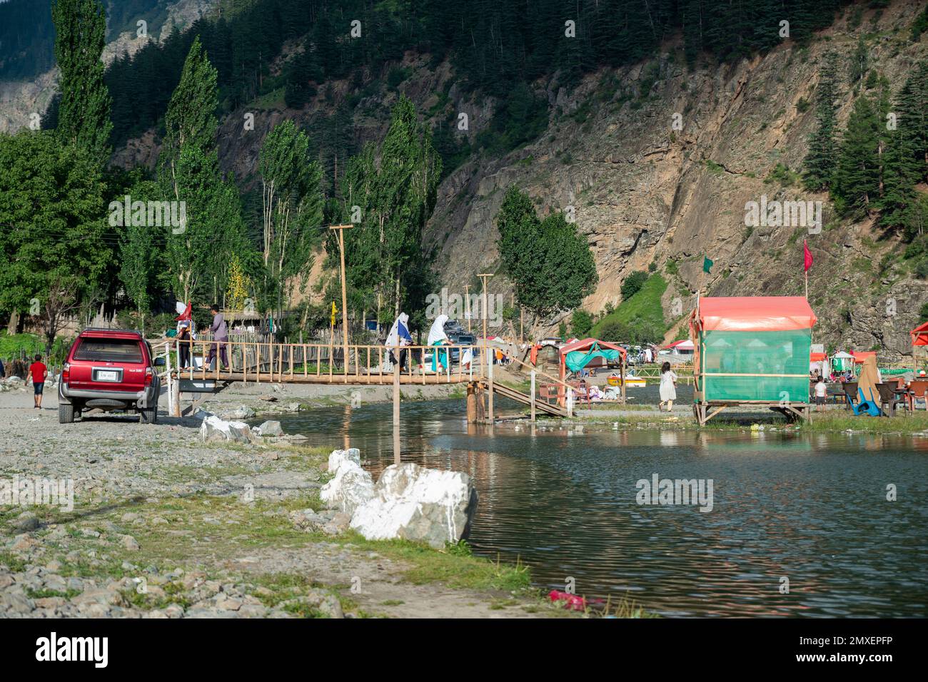 Pakistani people enjoying fresh air on the river in summer time, Swat ...