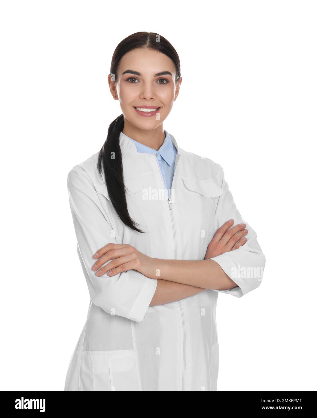 Happy young woman in lab coat on white background Stock Photo - Alamy