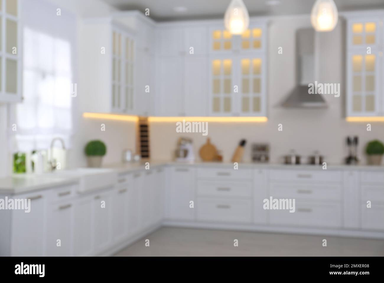 Blurred view of modern stylish kitchen interior Stock Photo - Alamy