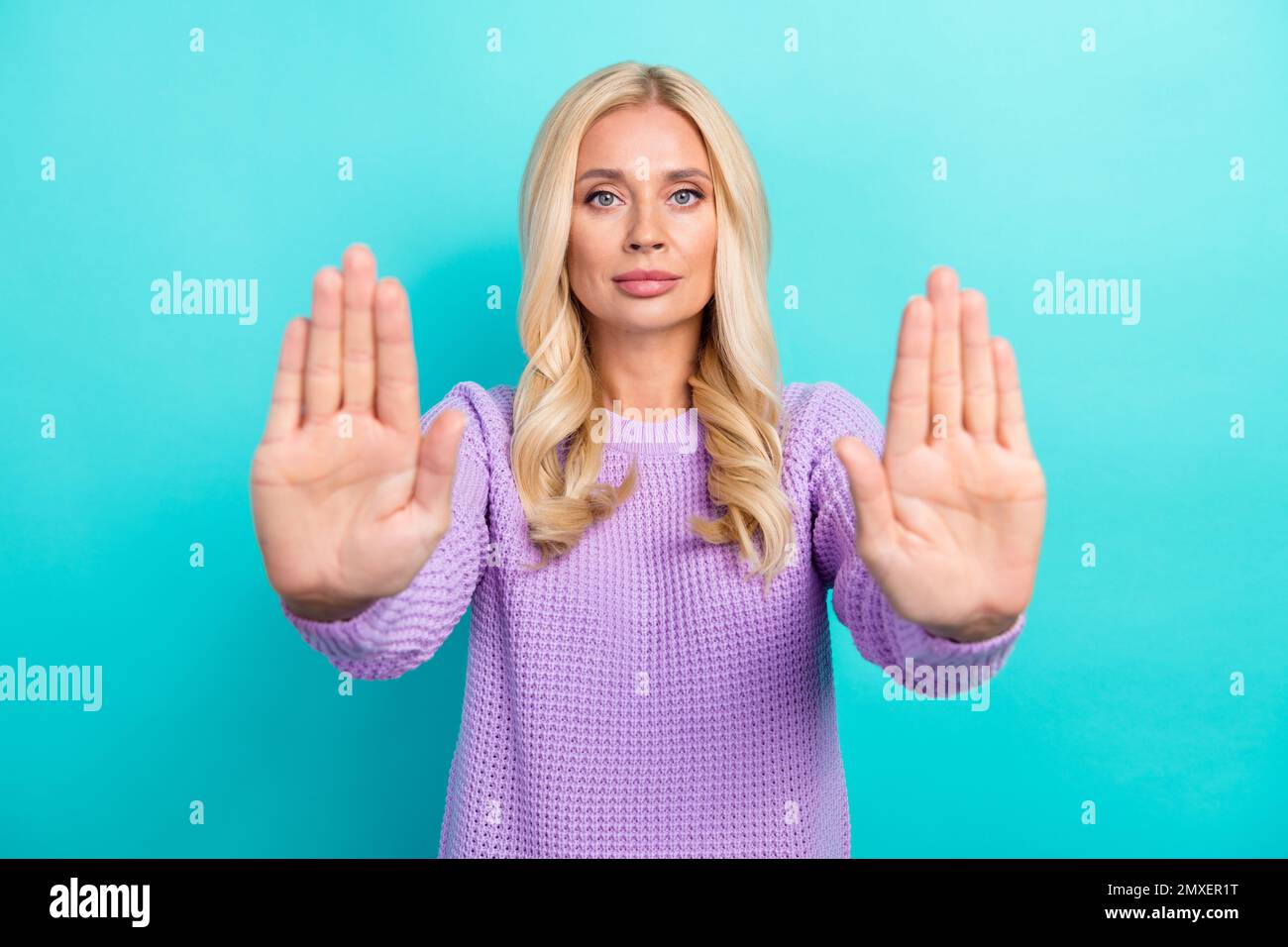 Portrait of concentrated lady hands palms demonstrate enough stop ...