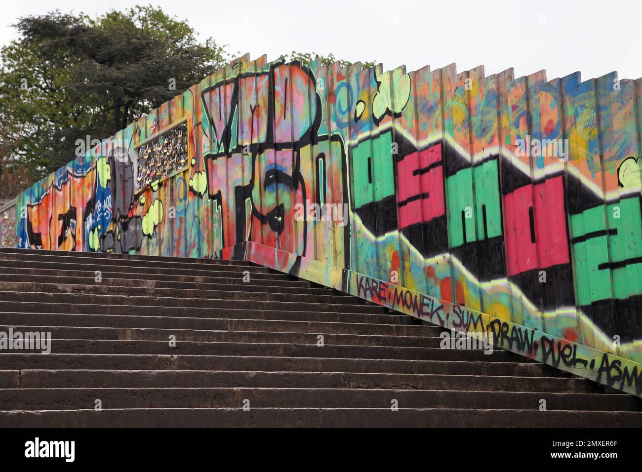 Graffiti covered fence on steps in Trocadero Gardens, Paris, France ...