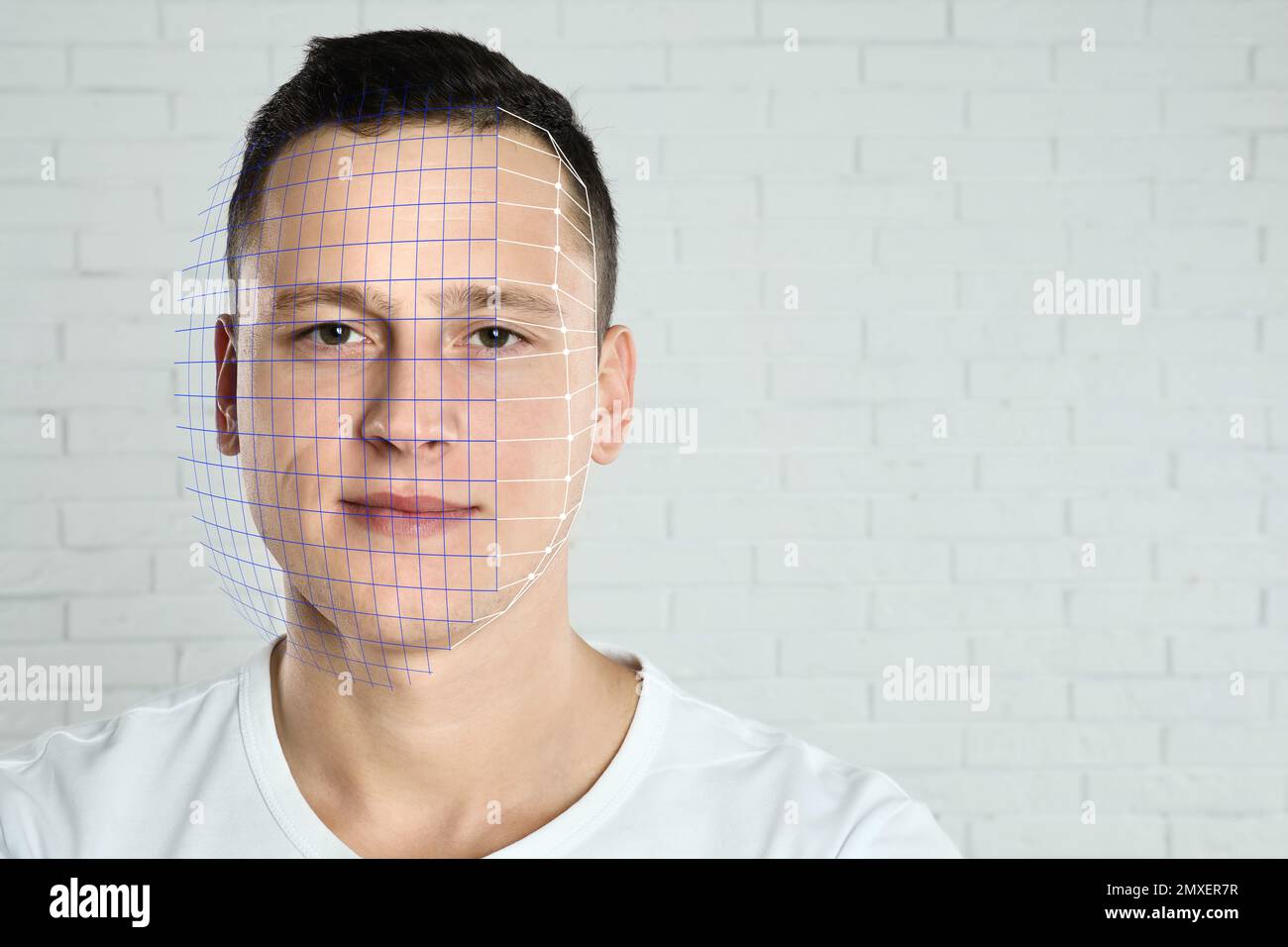 Facial recognition system. Man with digital biometric grid against ...