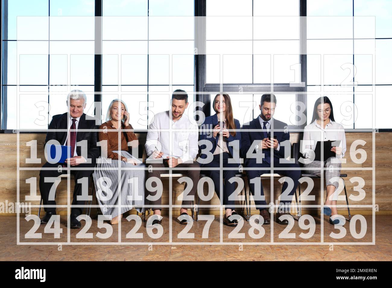 Calendar and people waiting for job interview in office hall Stock ...