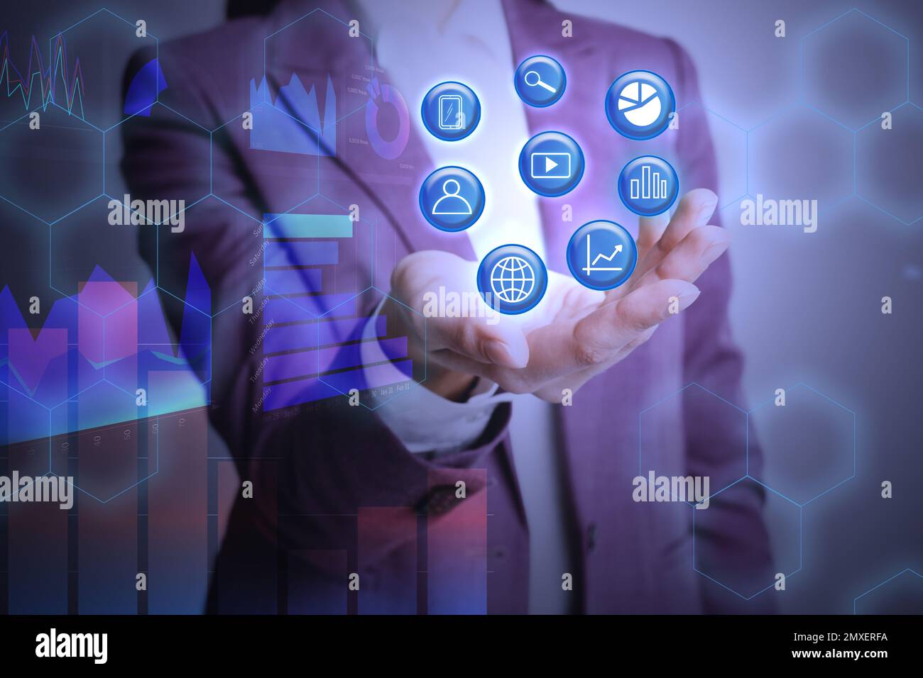 Woman demonstrating icons of data management system and digital charts ...