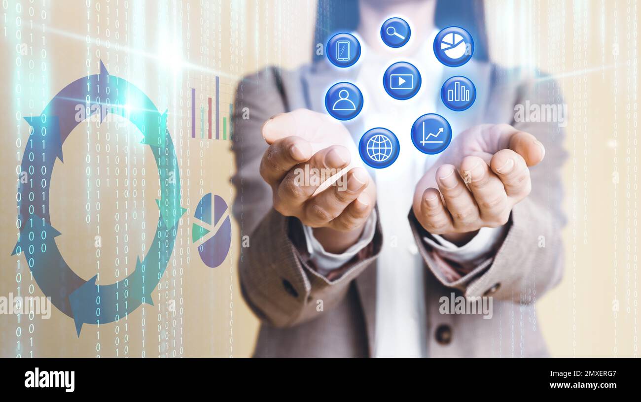Woman demonstrating icons of data management system and digital charts ...