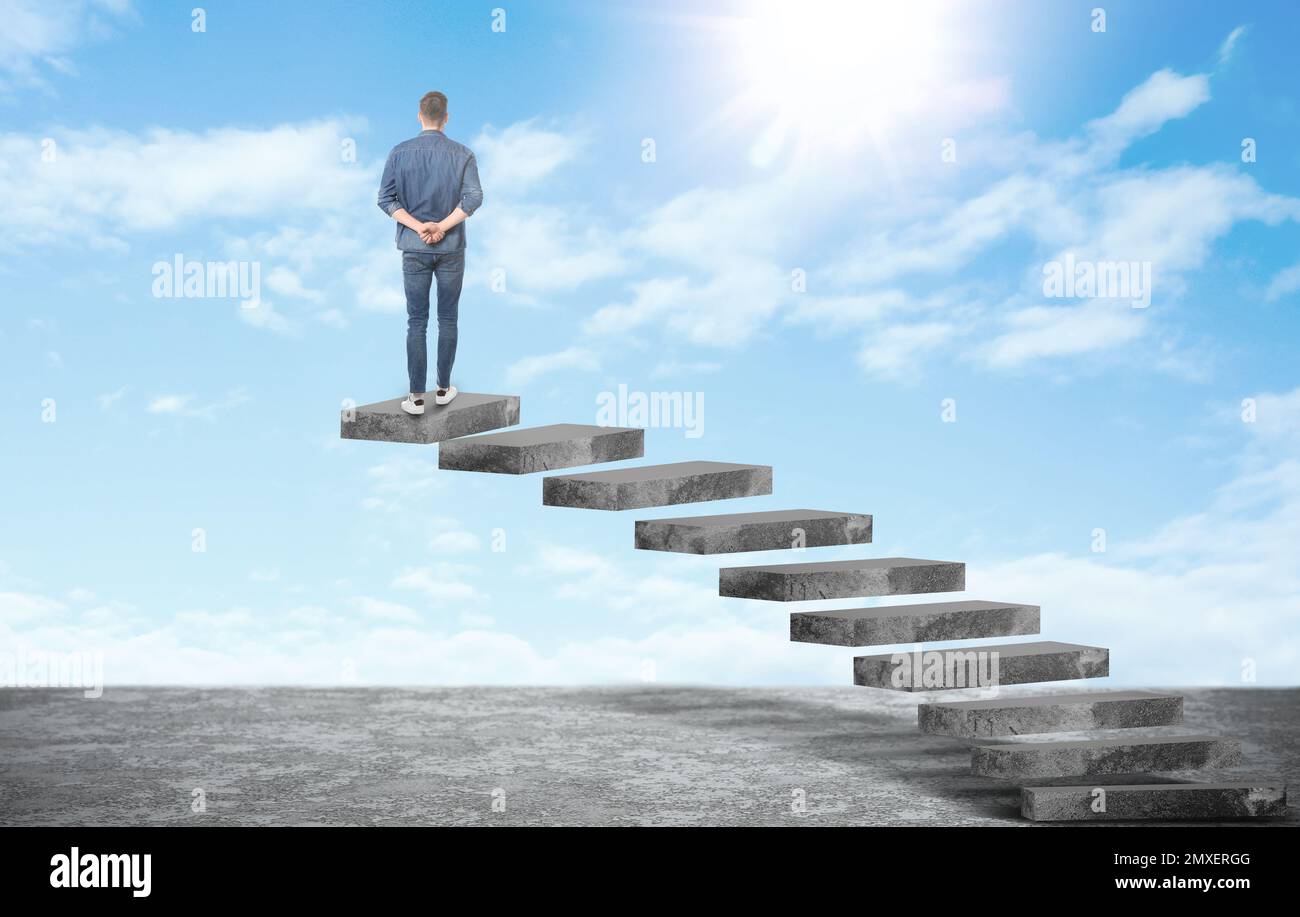 Man stairs clouds success hi-res stock photography and images - Alamy