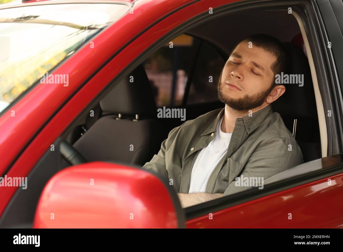 Tired man sleeping in his modern car Stock Photo - Alamy