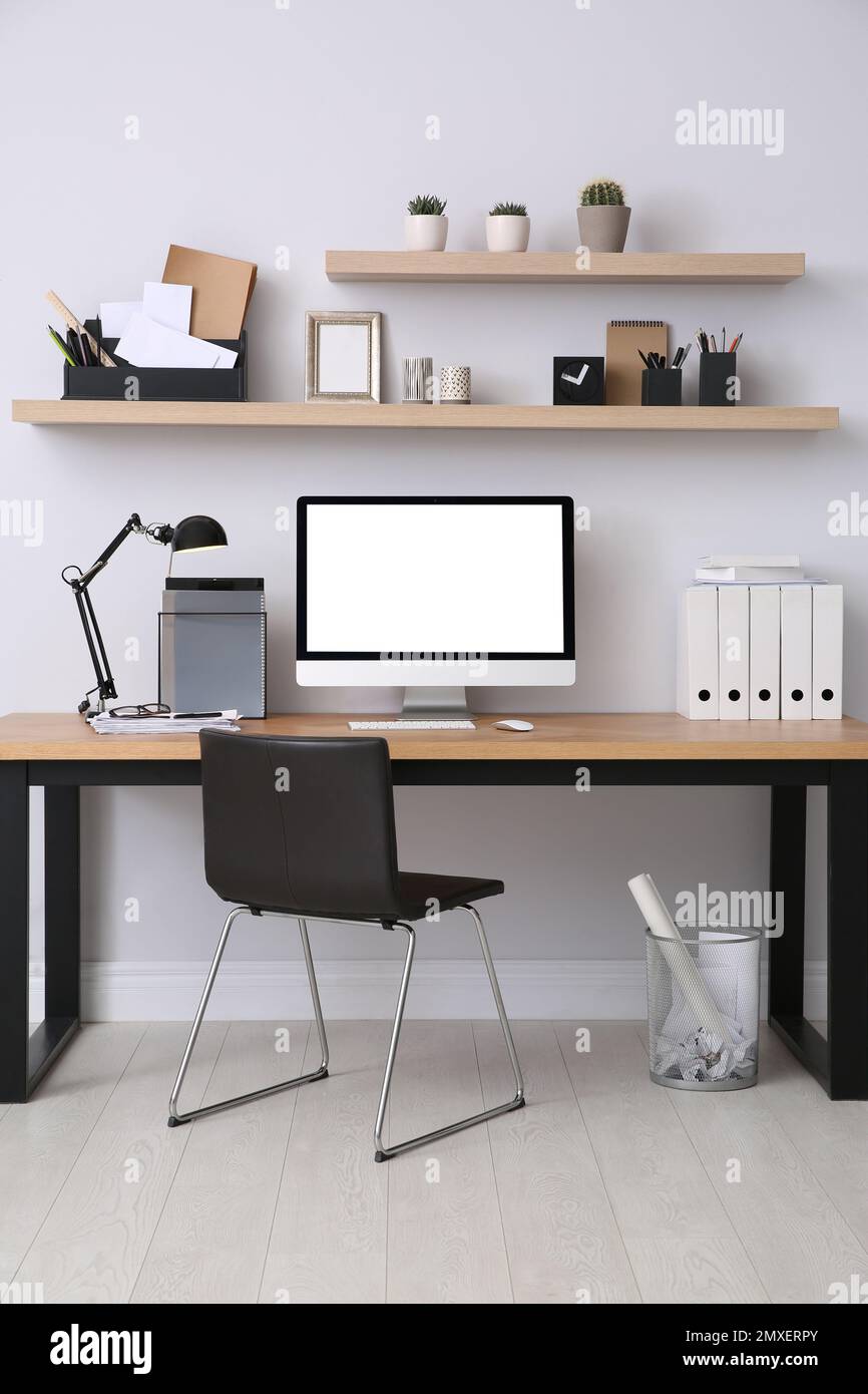 Modern computer on table in office interior. Stylish workplace Stock ...