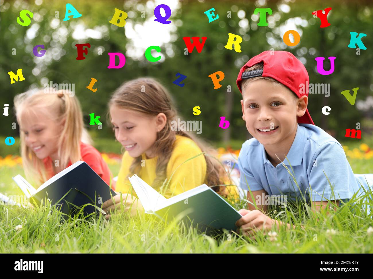 Group of kids reading outdoors hi-res stock photography and images - Alamy