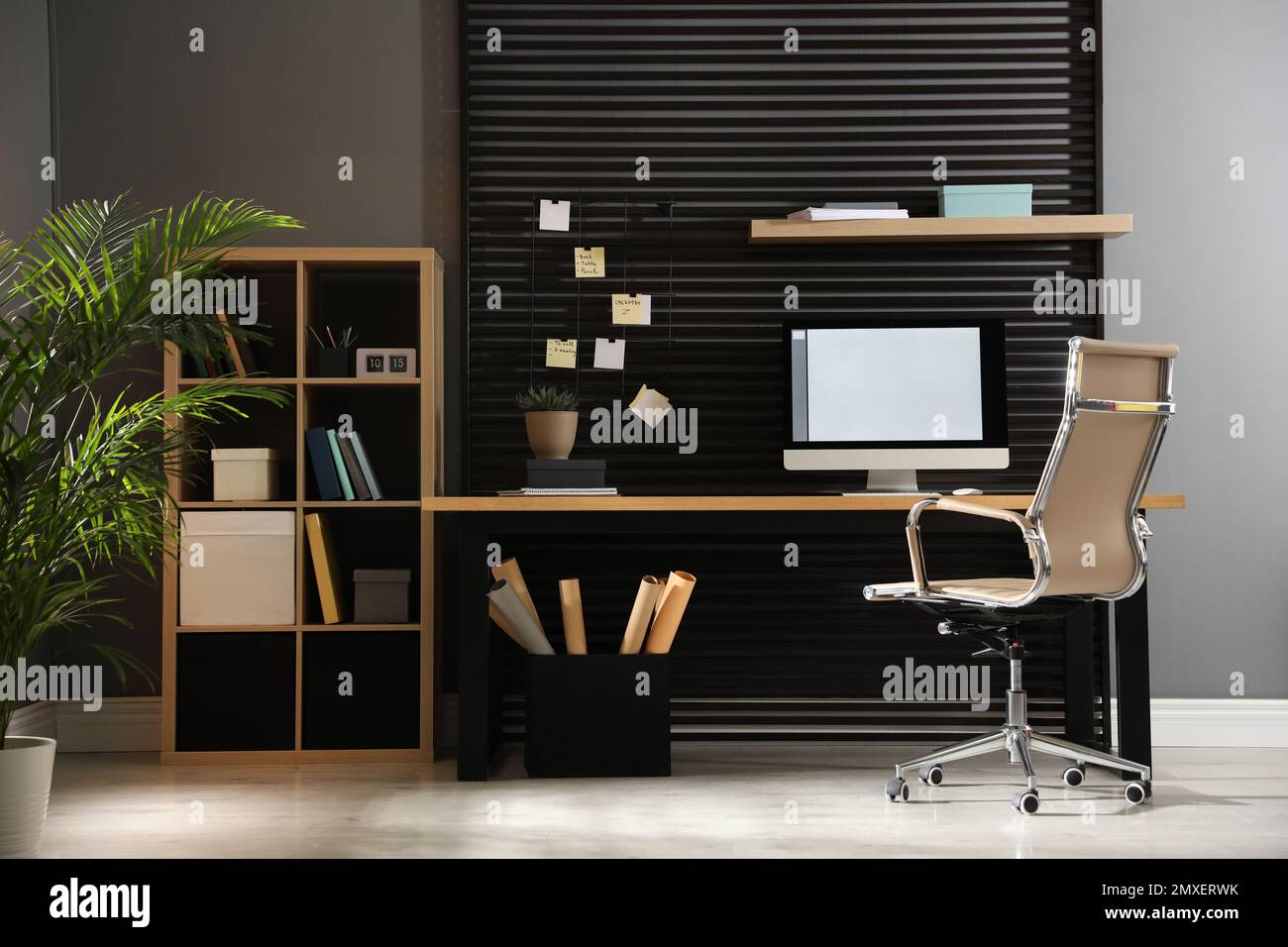 Comfortable workplace with computer and office chair. Stylish room ...