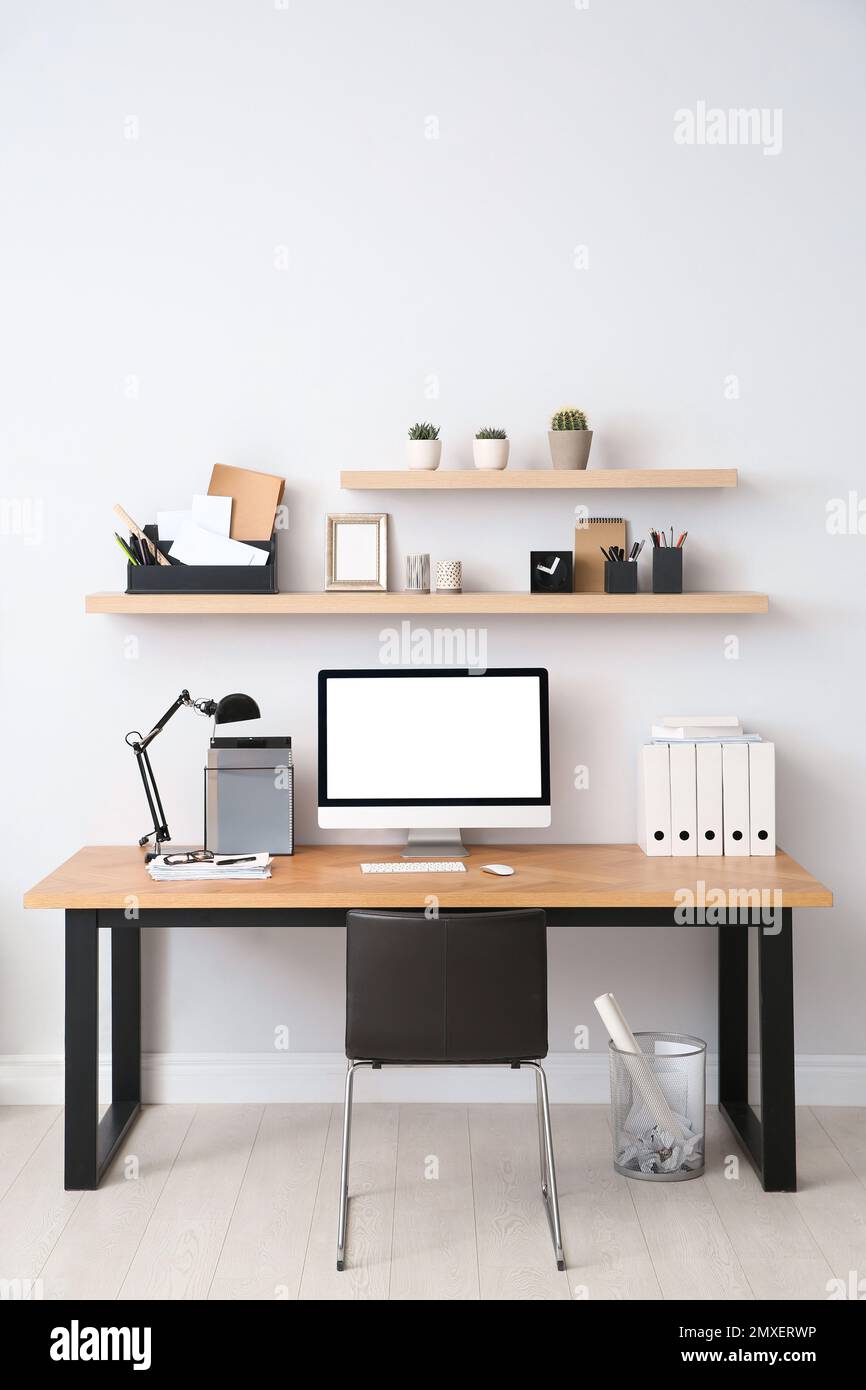 Modern computer on table in office interior. Stylish workplace Stock ...