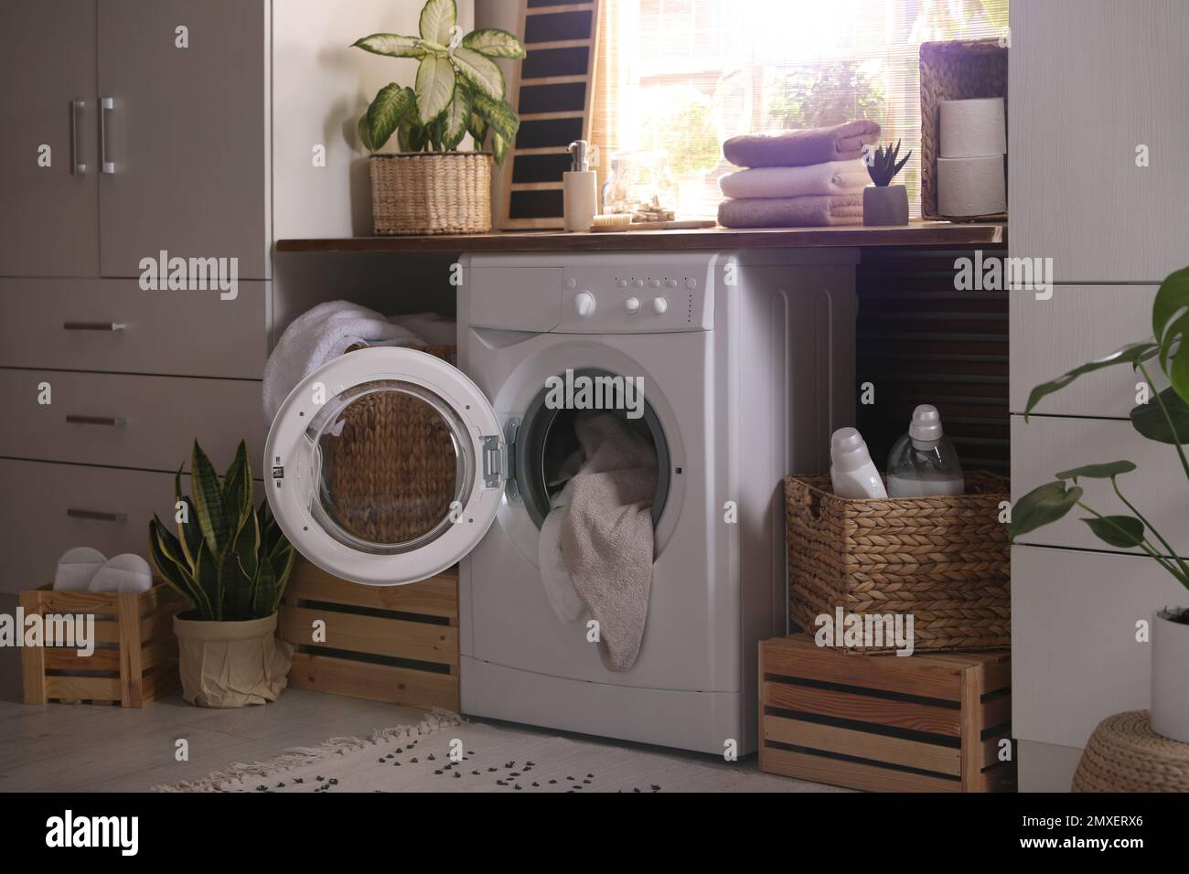 Stylish room interior with washing machine. Design idea Stock Photo - Alamy